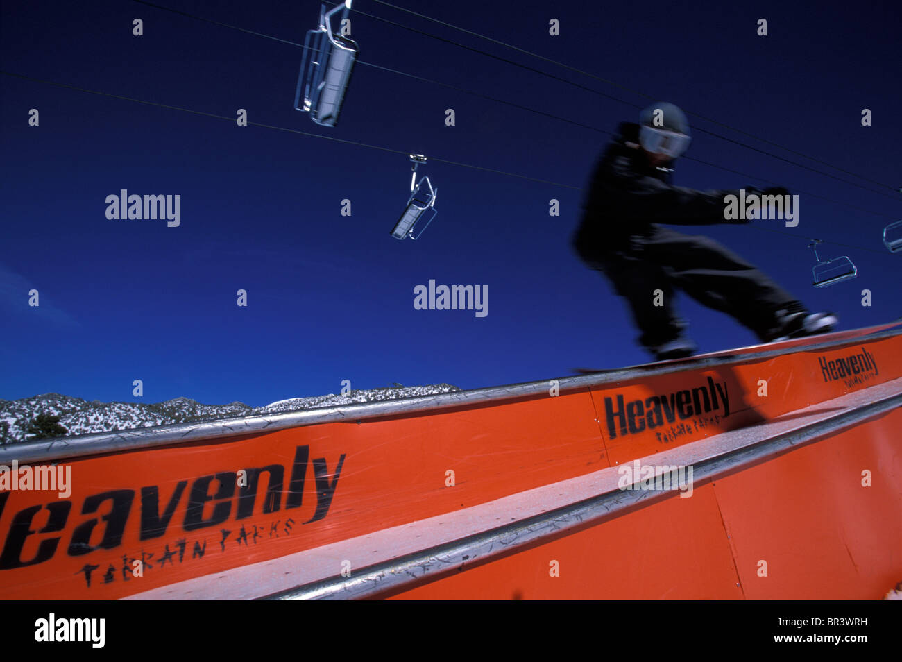 Snowboarder grinding rail hi-res stock photography and images - Alamy