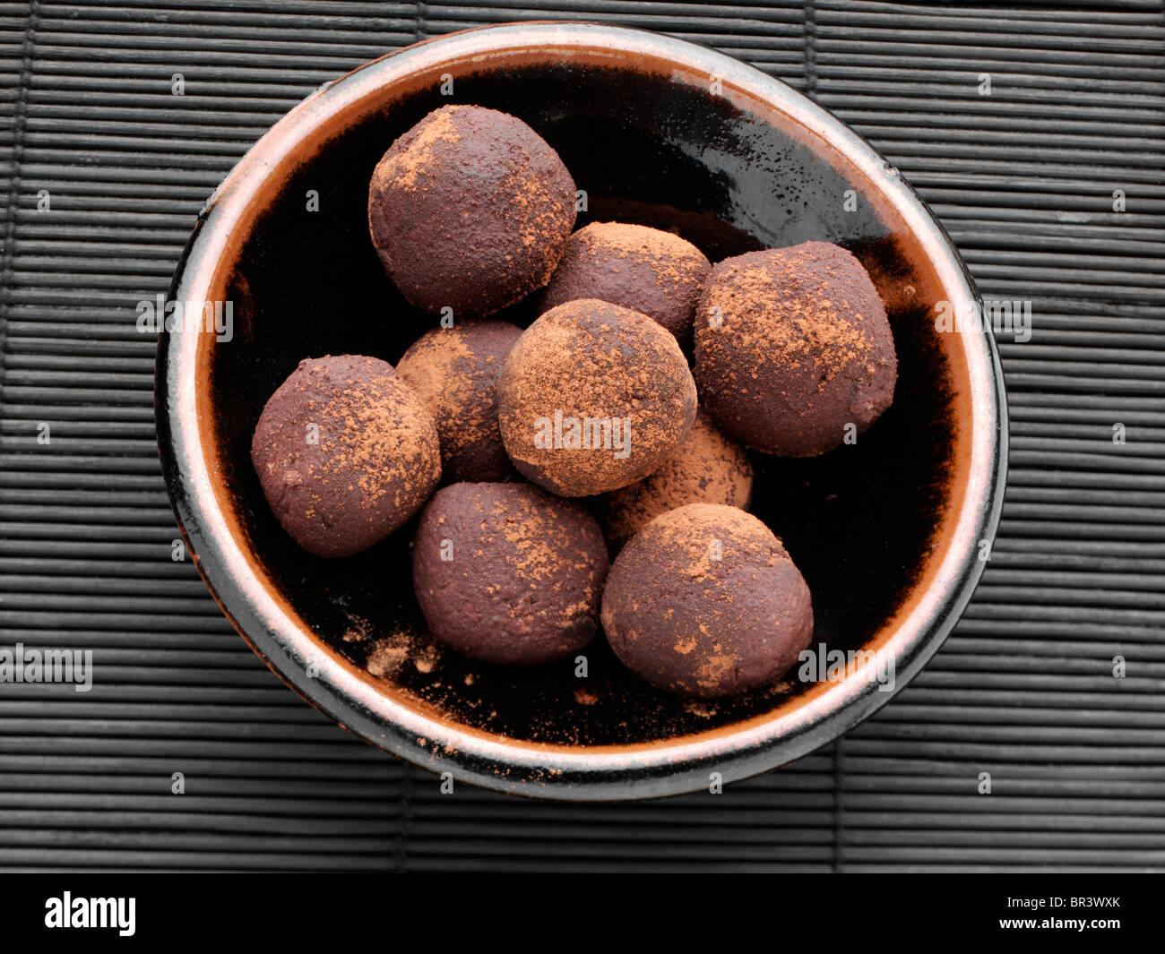 Chocolate truffles dusted with cocoa powder vegetarian treats Stock ...