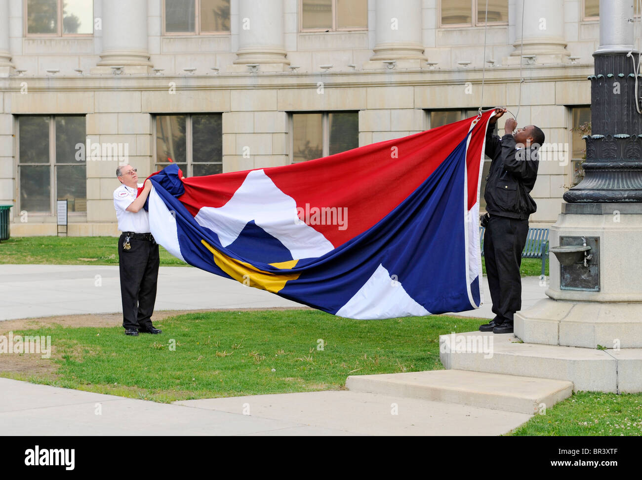 State Flag being folded at sunset Denver Colorado Stock Photo - Alamy