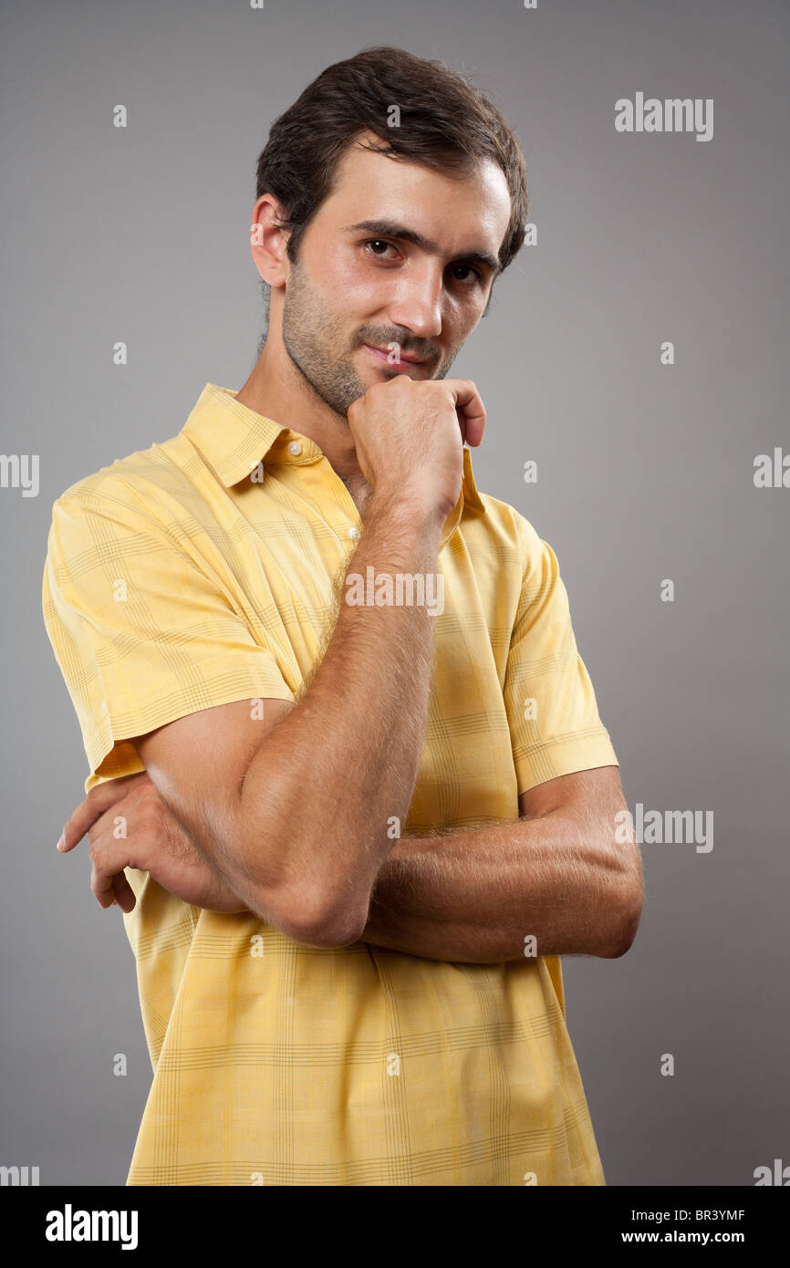 Studio portrait of a young caucasian man on gray background Stock Photo ...