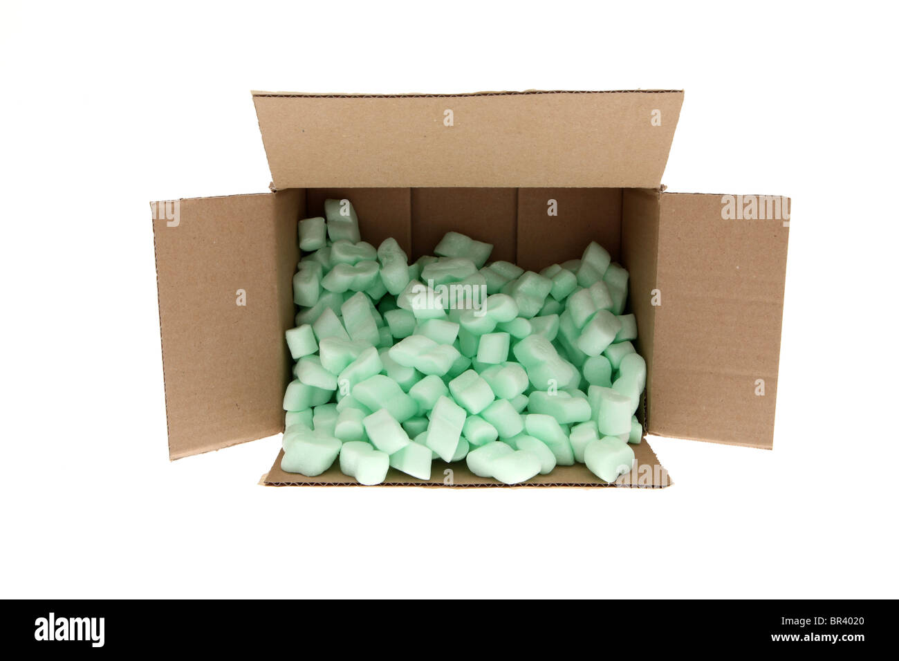 Brown cardboard box with green polystyrene packaging peanuts Stock ...