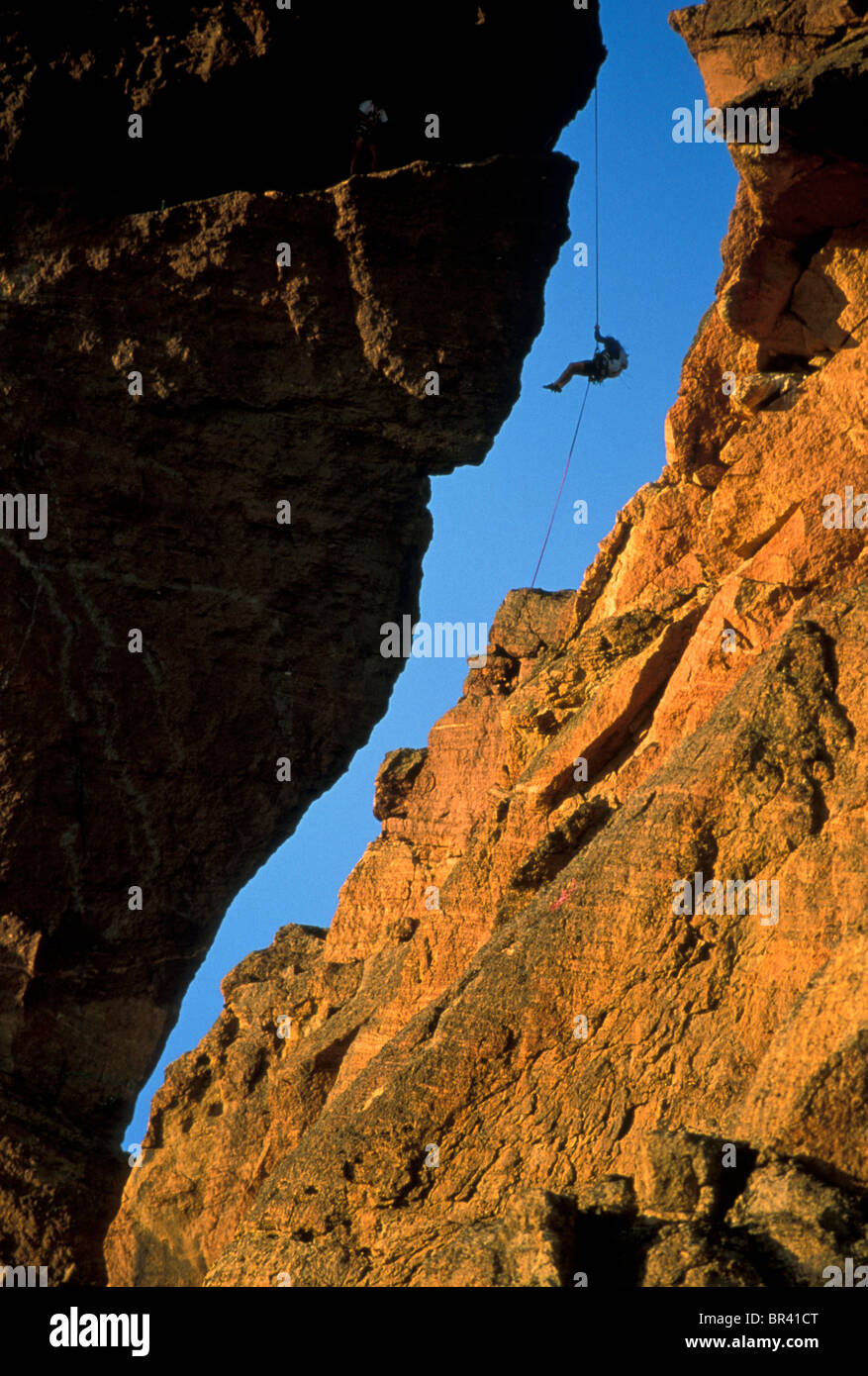 A climber rappels down Monkey Face at Smith Rock State Park, Oregon ...