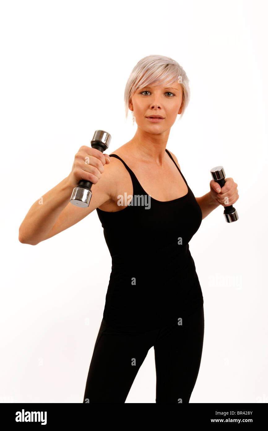 Exercising with hand weights as part of a fitness routine Stock Photo ...