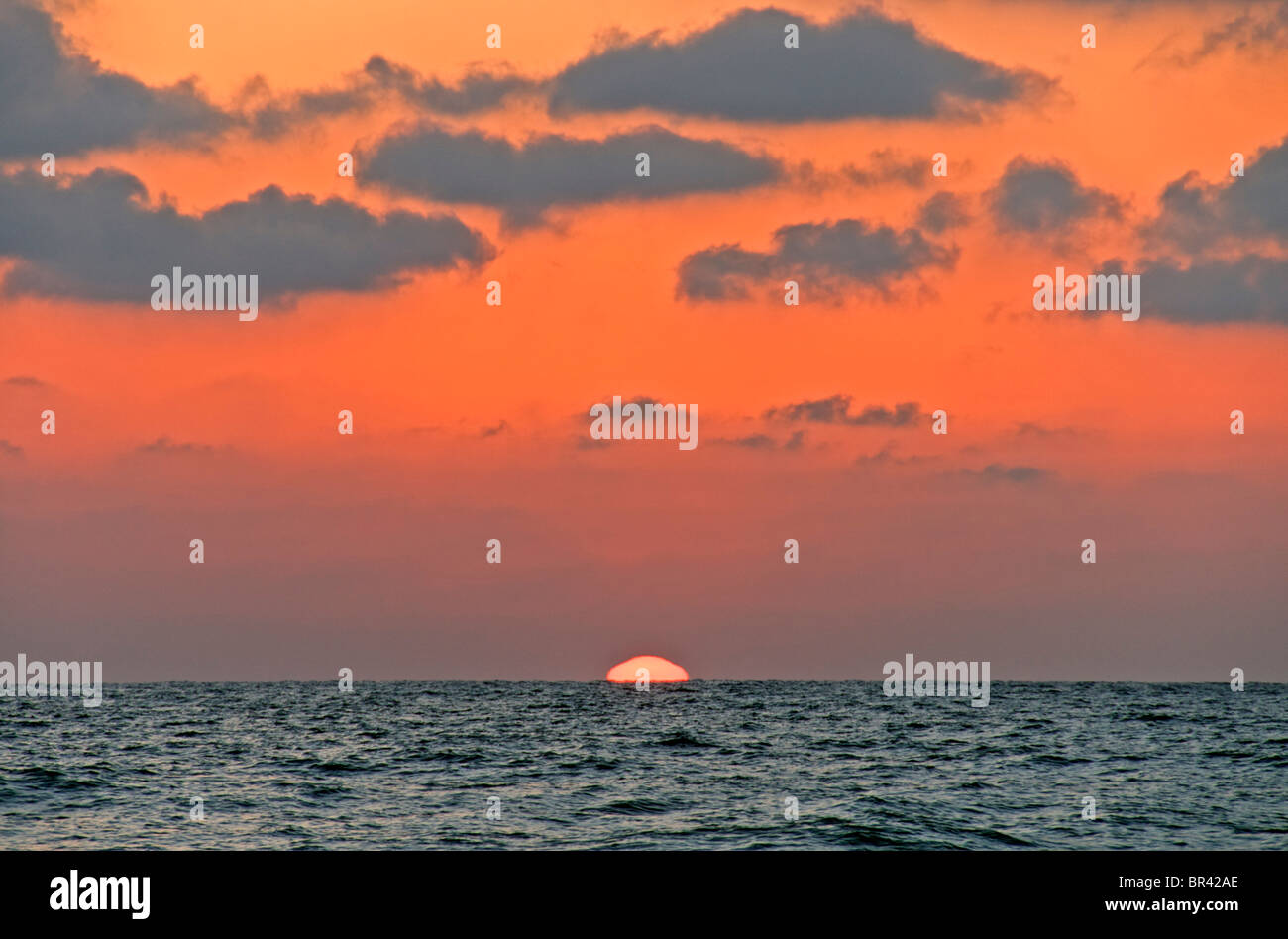 Red sunset sun set sky warm setting evening cloud backdrop hi-res stock ...