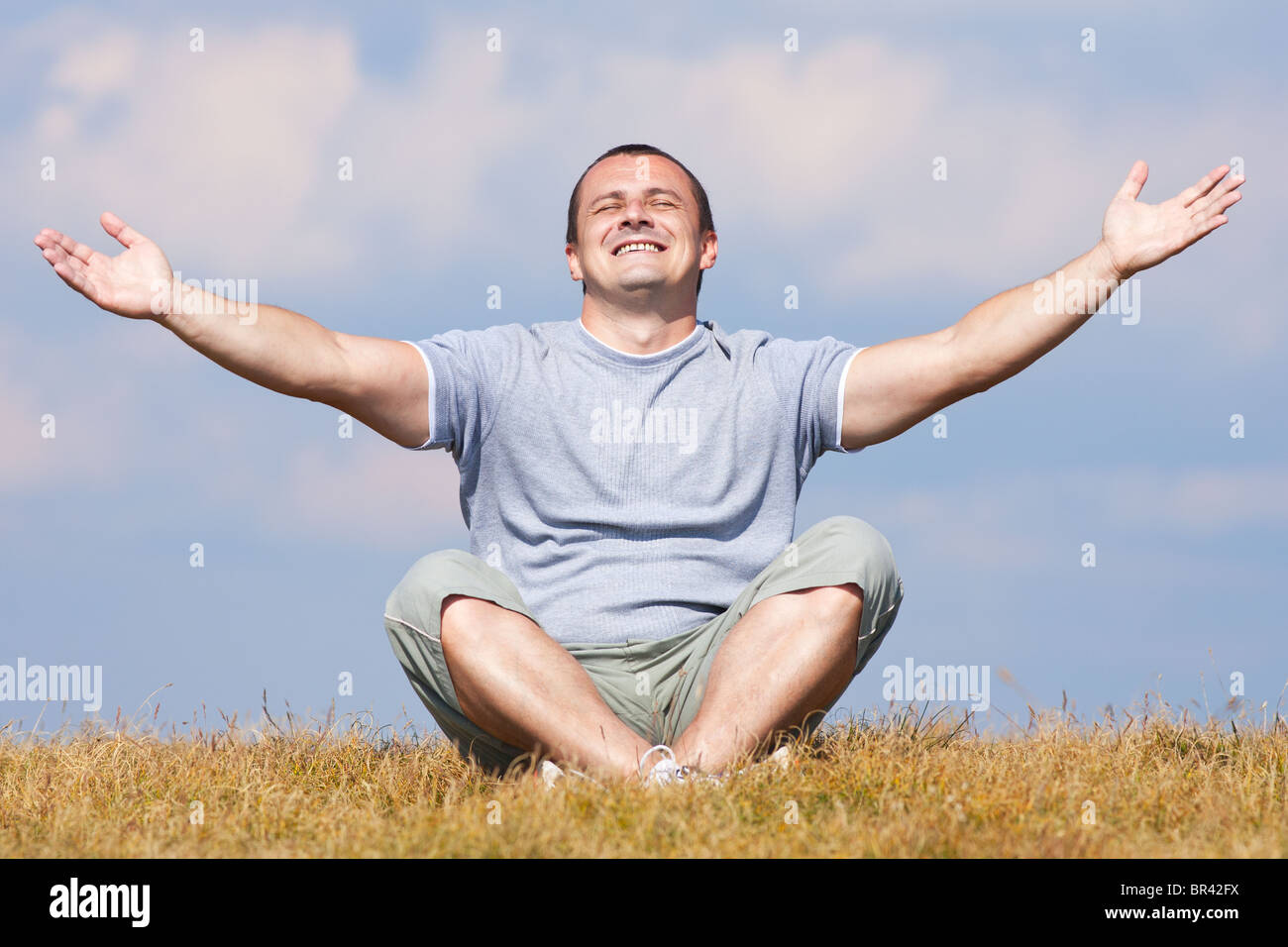Portrait of a young man outdoor with sky in the background Stock Photo ...