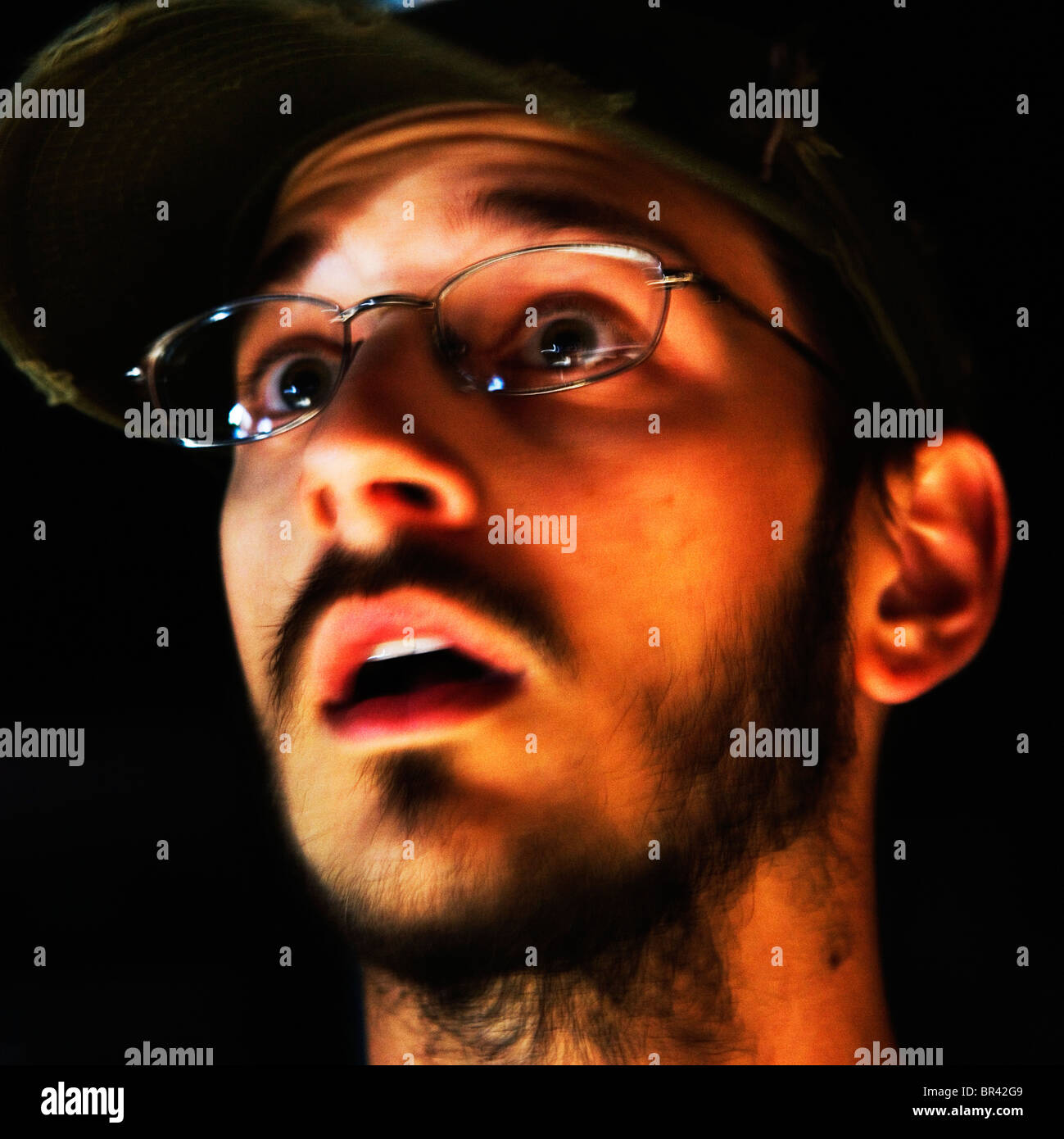 Portrait of a young man with a surprised look on his face Stock Photo ...