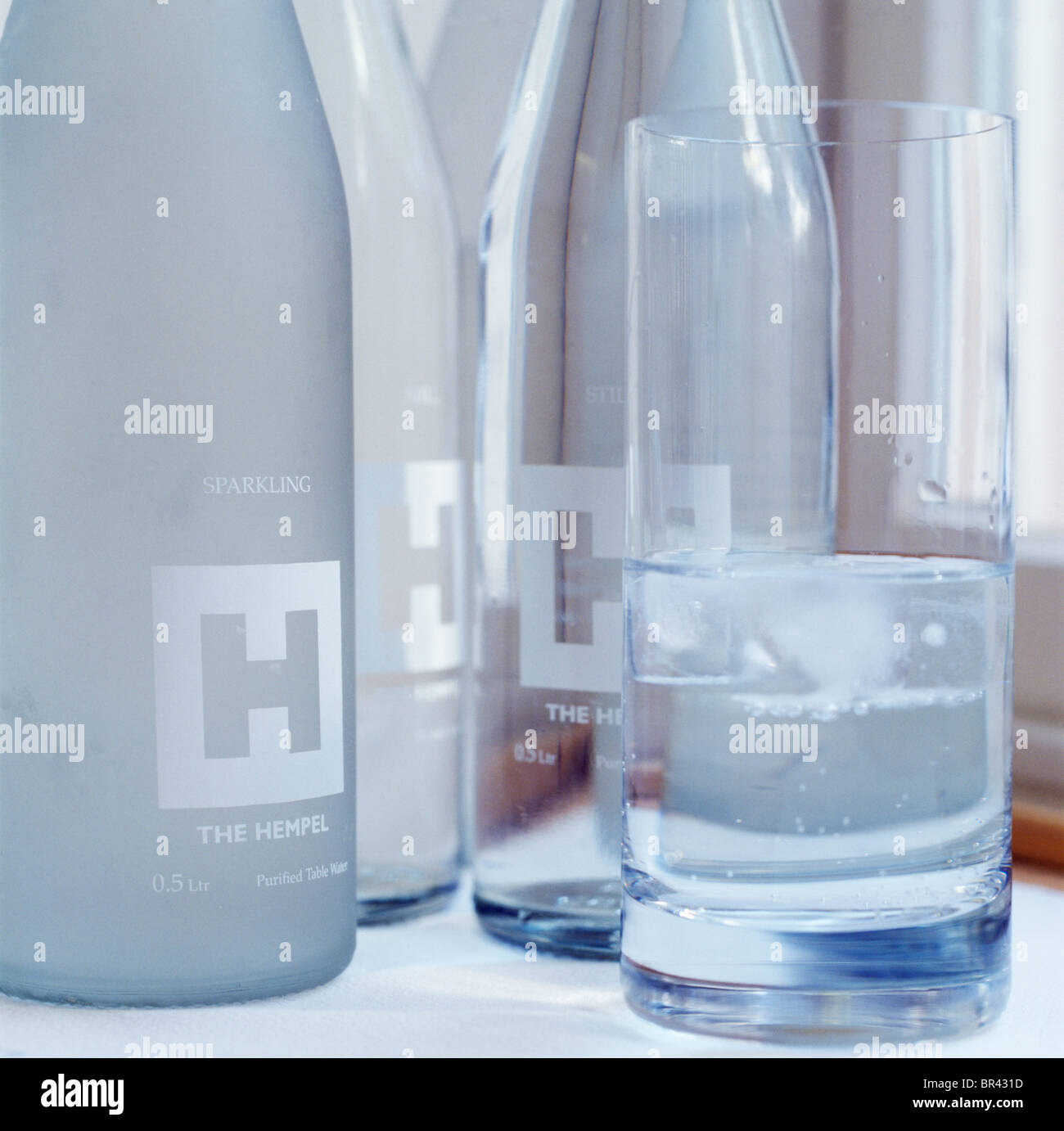 Close-up of engraved glass bottles and water glass at The Hempel Hotel ...