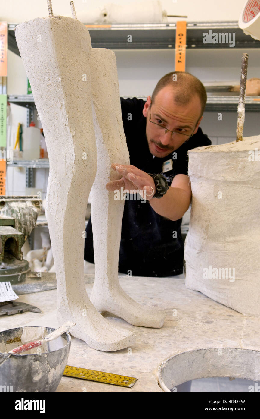 An orthopaedic technician making a plaster form, Berlin, Germany Stock ...