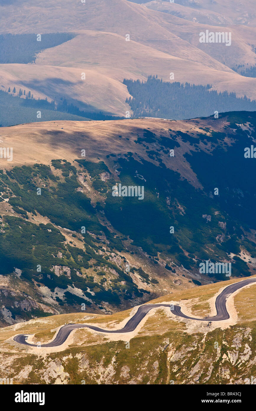 Beautiful landscape with mountains and winding road Stock Photo - Alamy