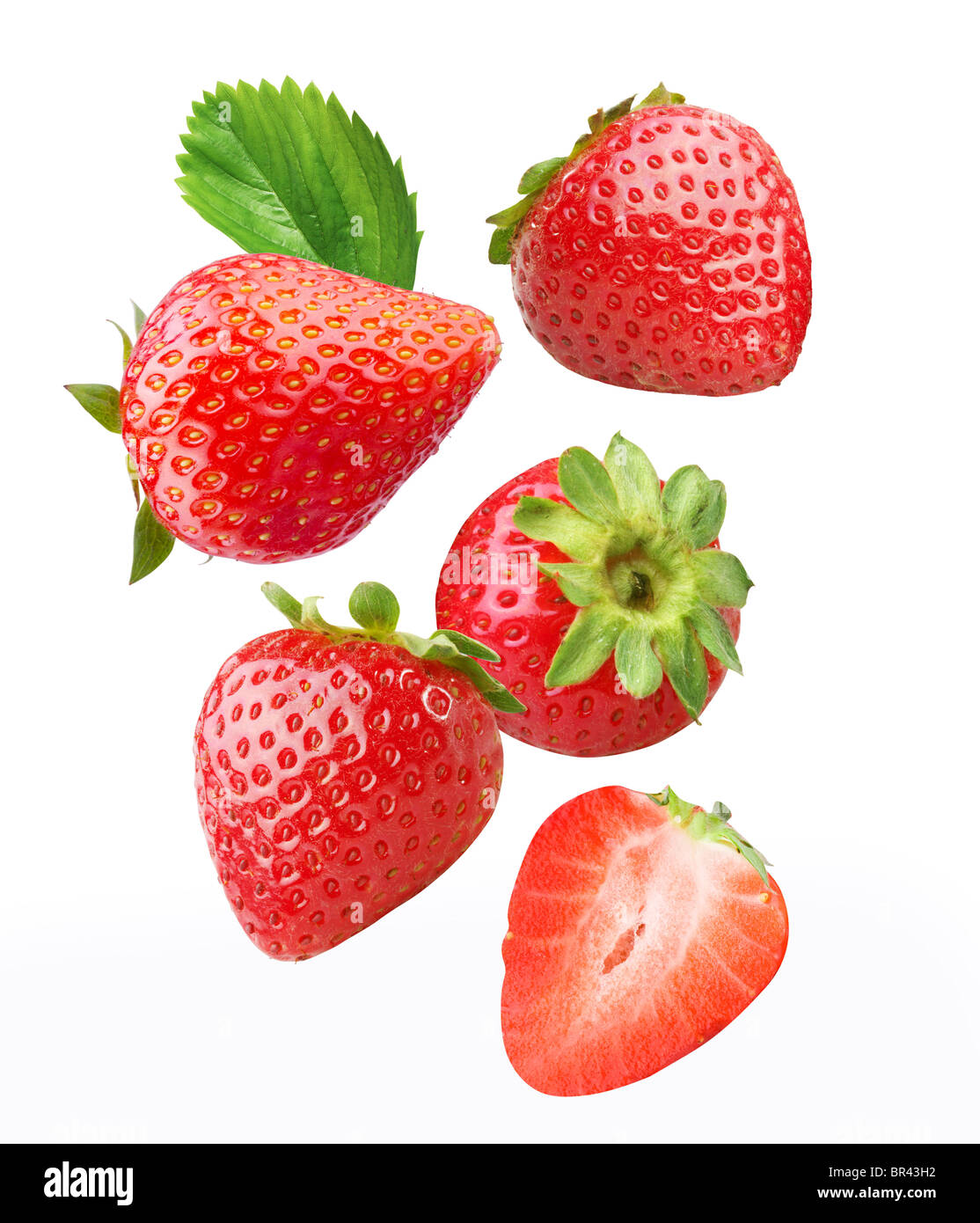 Falling strawberries. Isolated on a white background Stock Photo - Alamy