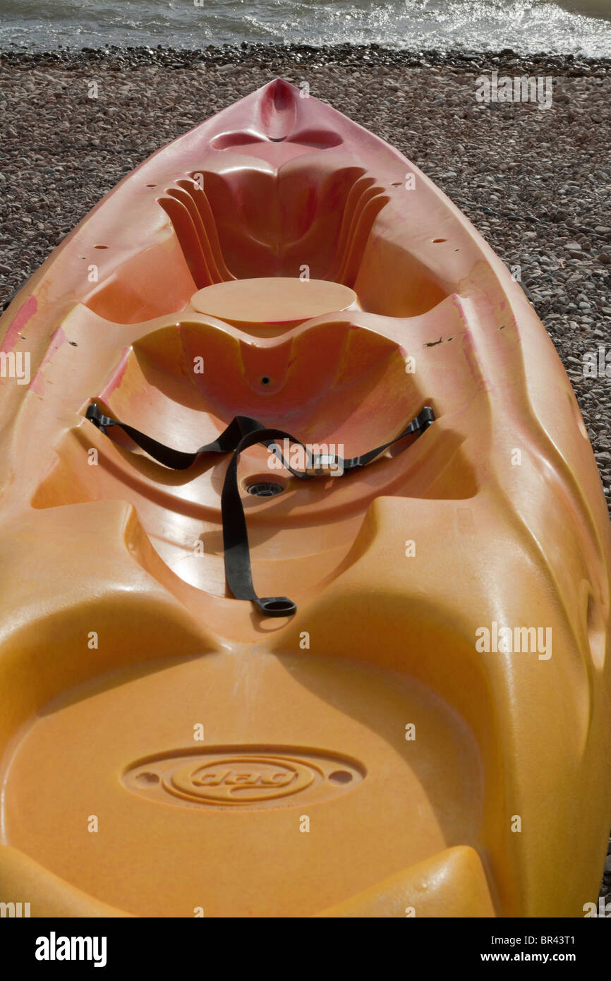 Brightly colored sea kayak on the beach Stock Photo - Alamy