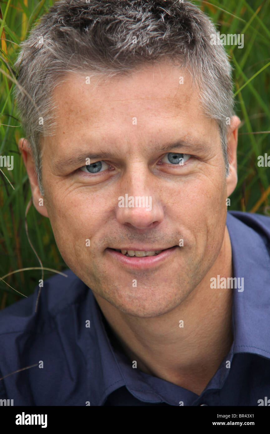 Smiling man outdoors, portrait Stock Photo - Alamy