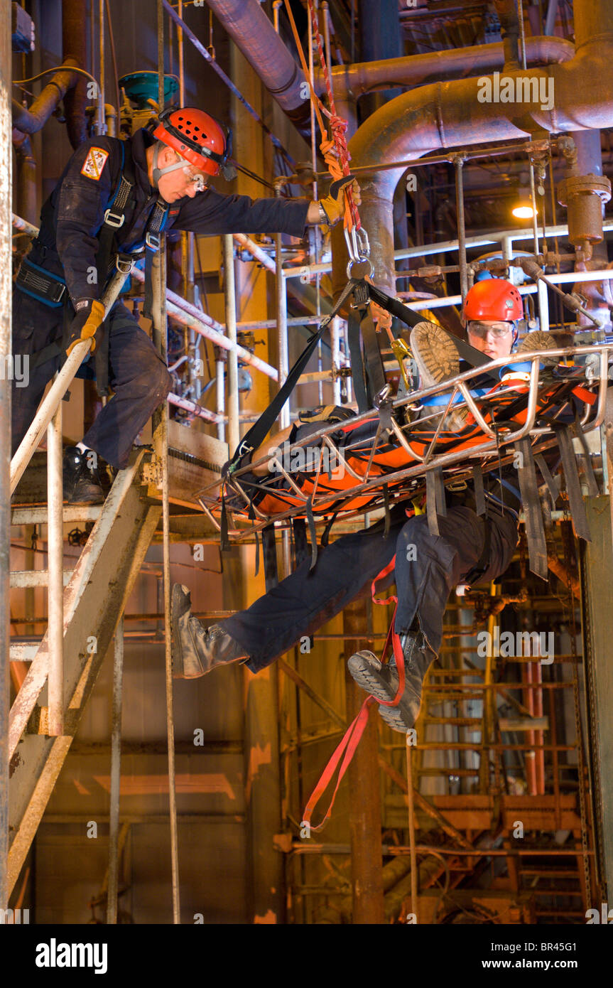 Firemen practice Industrial Search and Rescue training in an old ...
