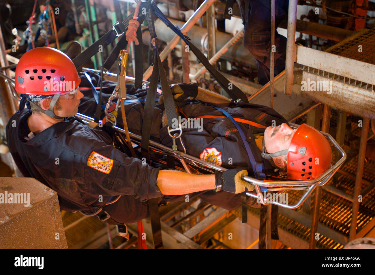 Firemen practice Industrial Search and Rescue training in an old ...