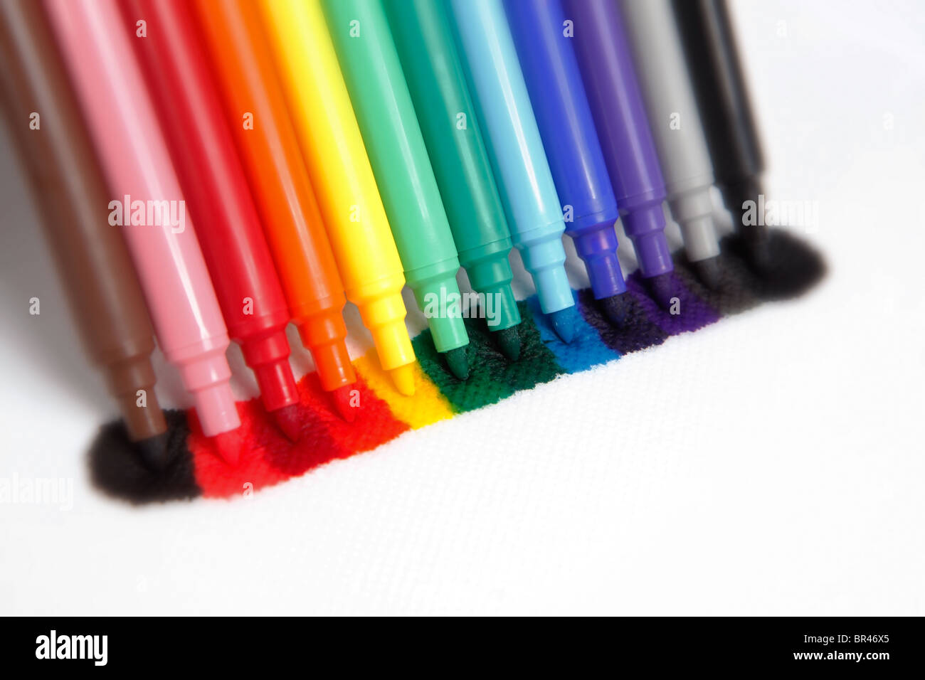 Colorful markers on white background. With beautiful vibrant colors ...