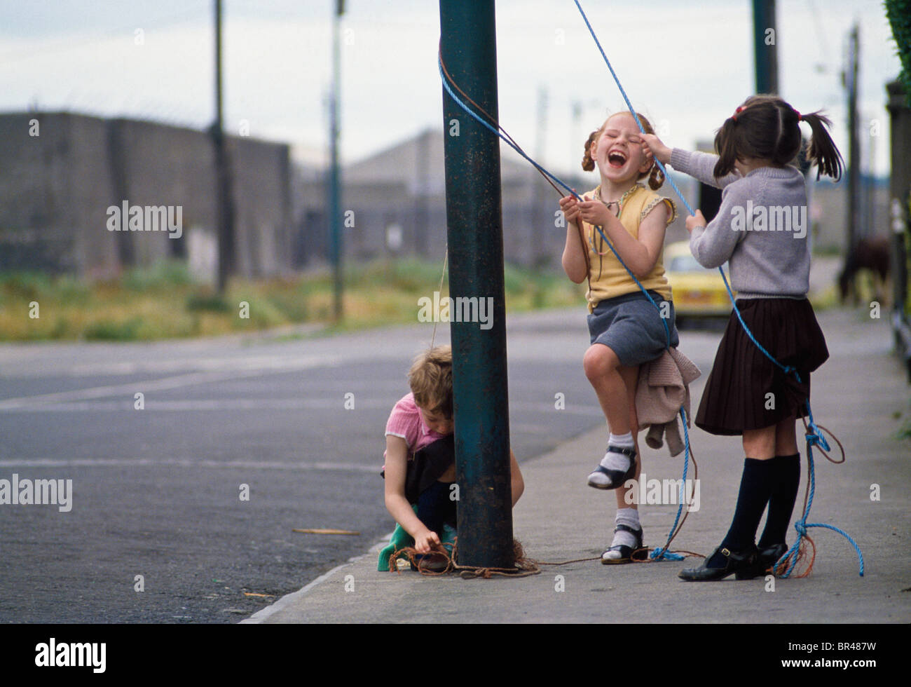 Sally Go Round The Lamp, Children's Street Games Stock Photo - Alamy