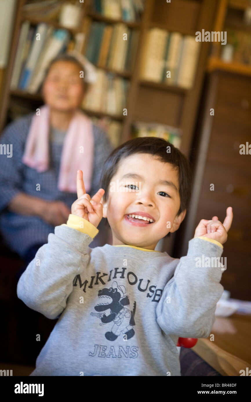 Young Japanese boy flashing 'peace' sign, Takayama, Japan Stock Photo ...