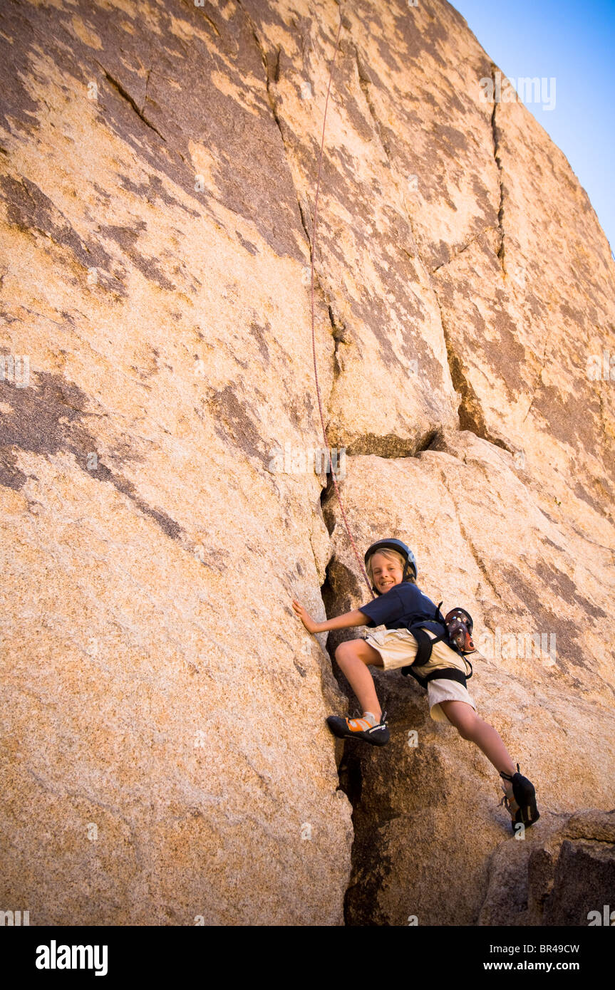 Young boy rock climbing at Joshua Tree, California Stock Photo - Alamy