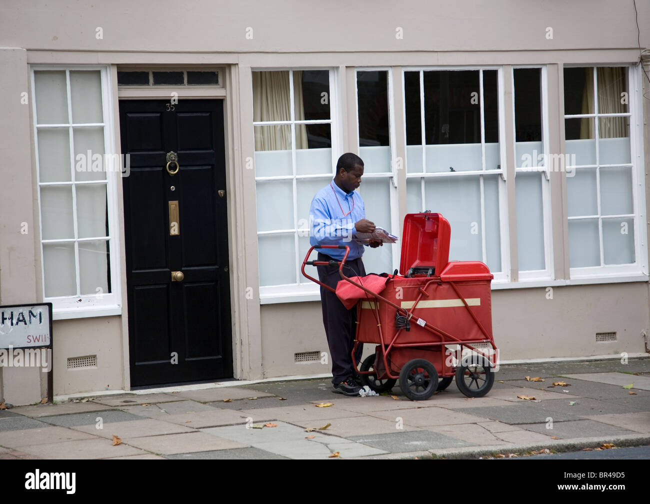 Postman delivering letters hi-res stock photography and images - Alamy