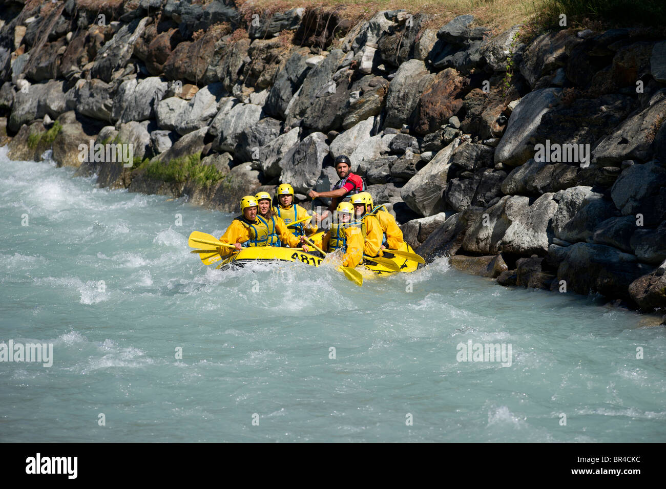 Tourists try whitewater rafting through small rapids in the Italian ...
