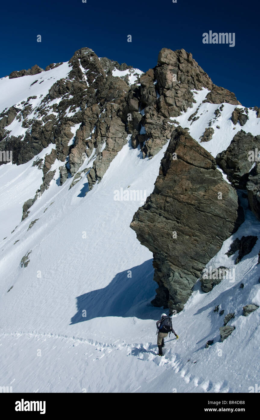 New Zealand, South Island, Arrowsmith Range. NOLS student Alex Saxon ...