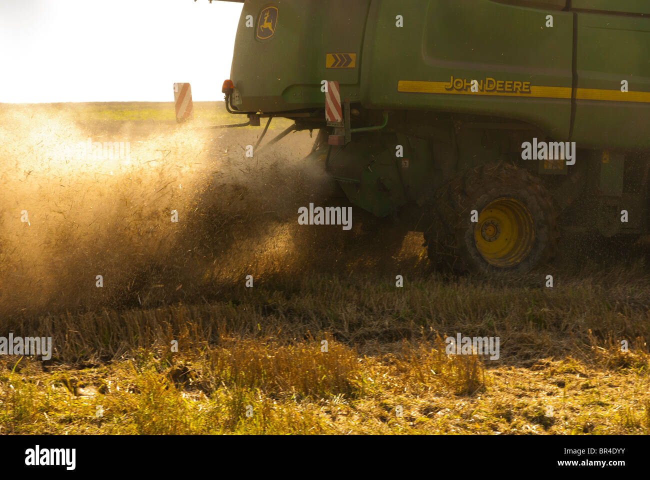 John Deere combine harvesting wheat on a field Stock Photo - Alamy