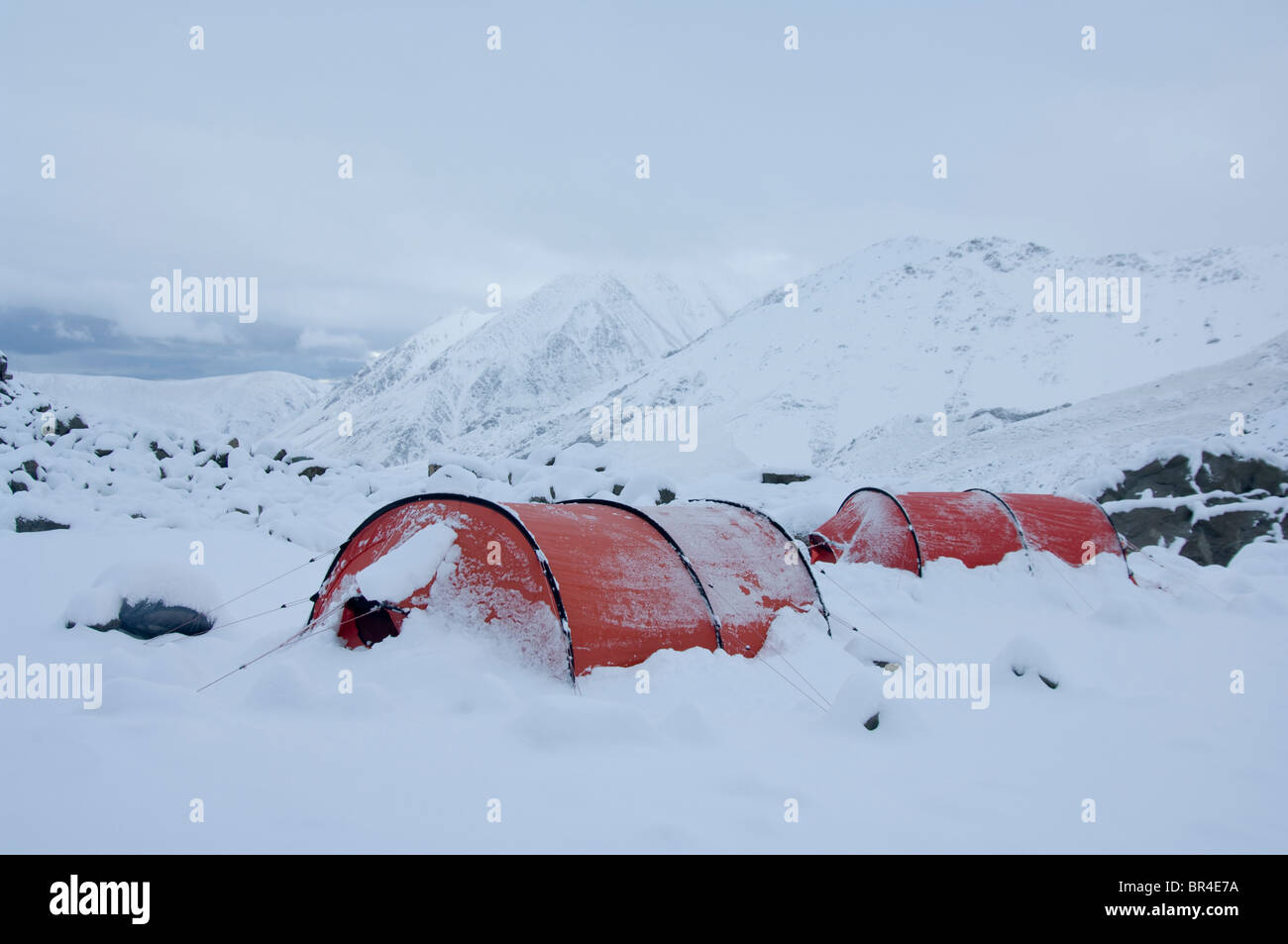 New Zealand, South Island, Arrowsmith Range. Snowy campsite with ...