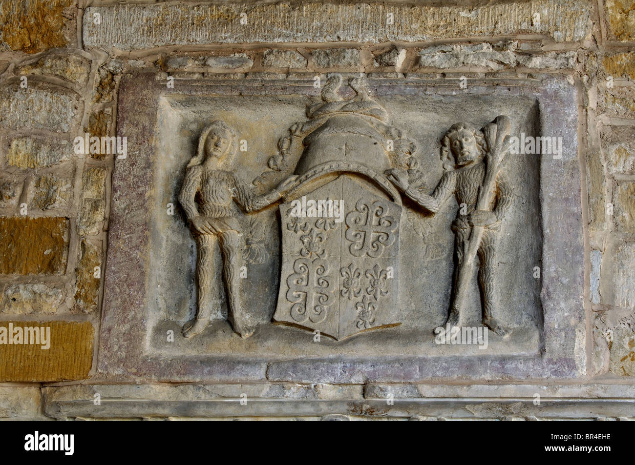 Plaque bearing coat of arms of Folville and Woodford, St. Mary`s Church ...
