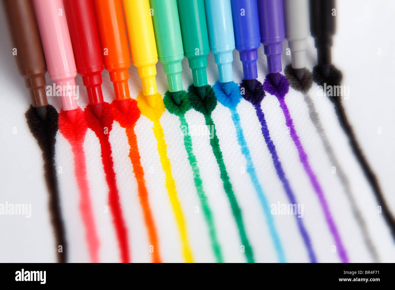 Colorful markers on white background. With beautiful vibrant colors ...