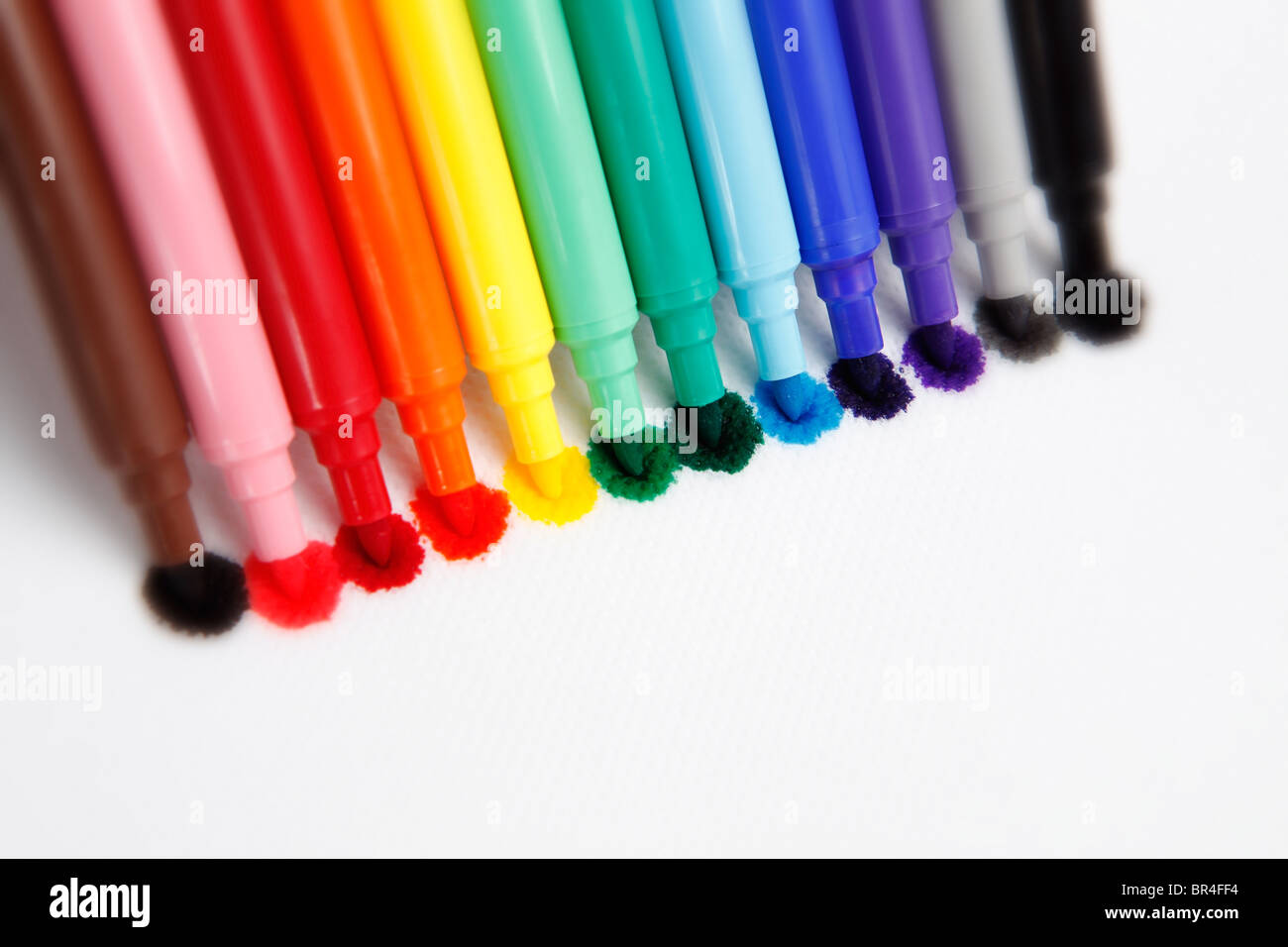 Colorful markers on white background. With beautiful vibrant colors ...