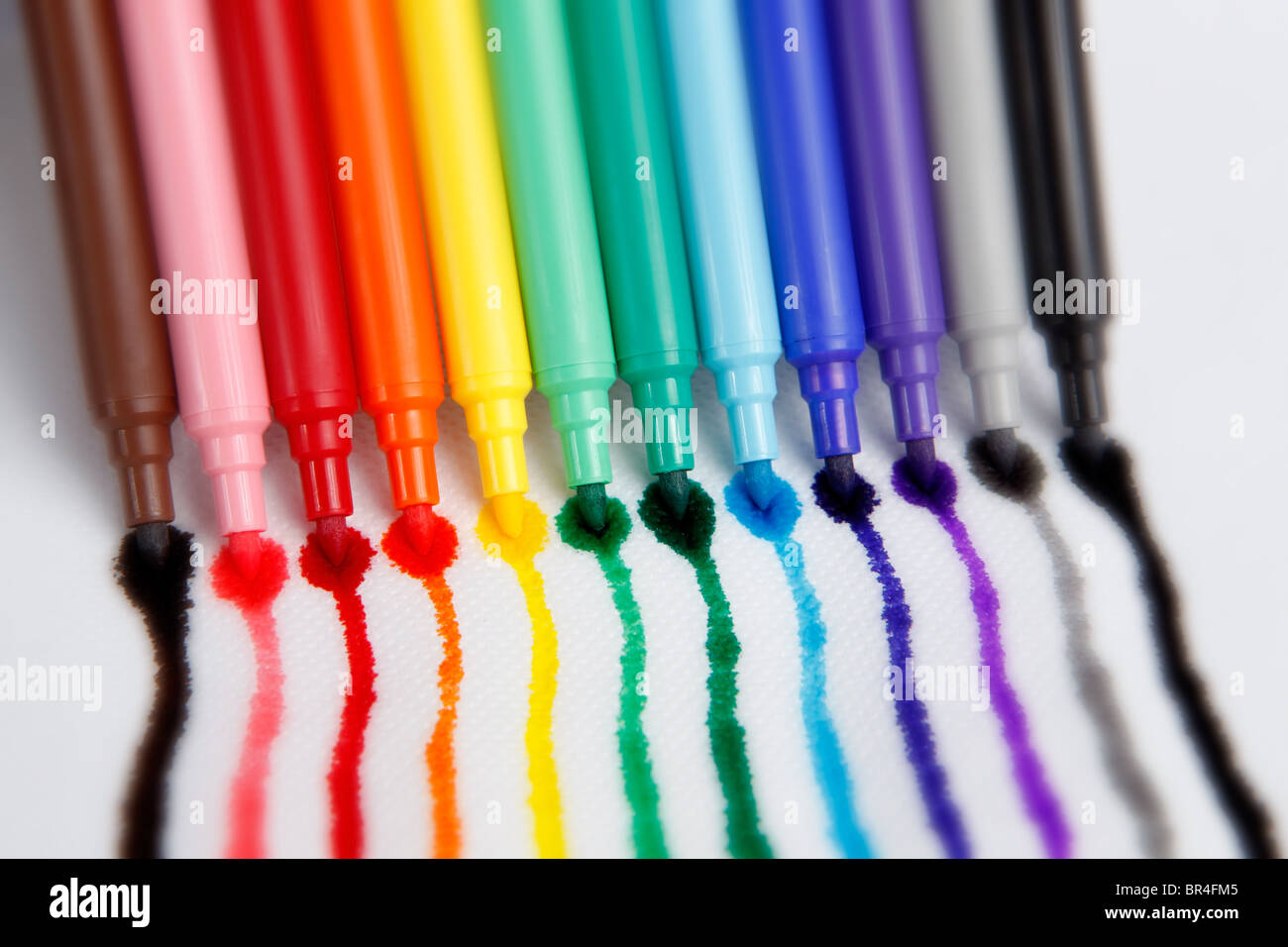 Colorful markers on white background. With beautiful vibrant colors ...
