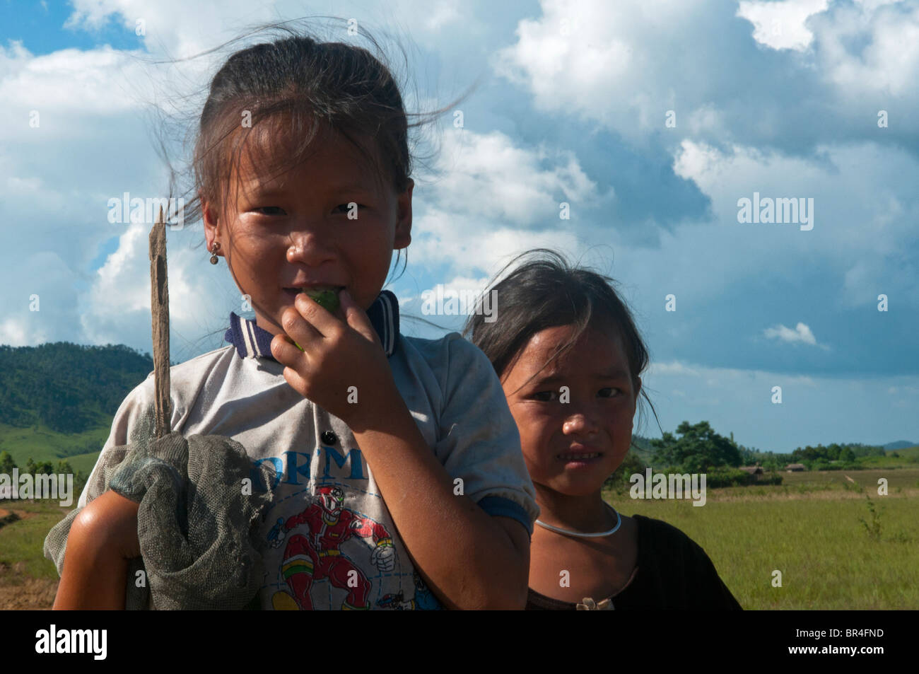 young girls posing for their first photo in rural Laos Stock Photo - Alamy