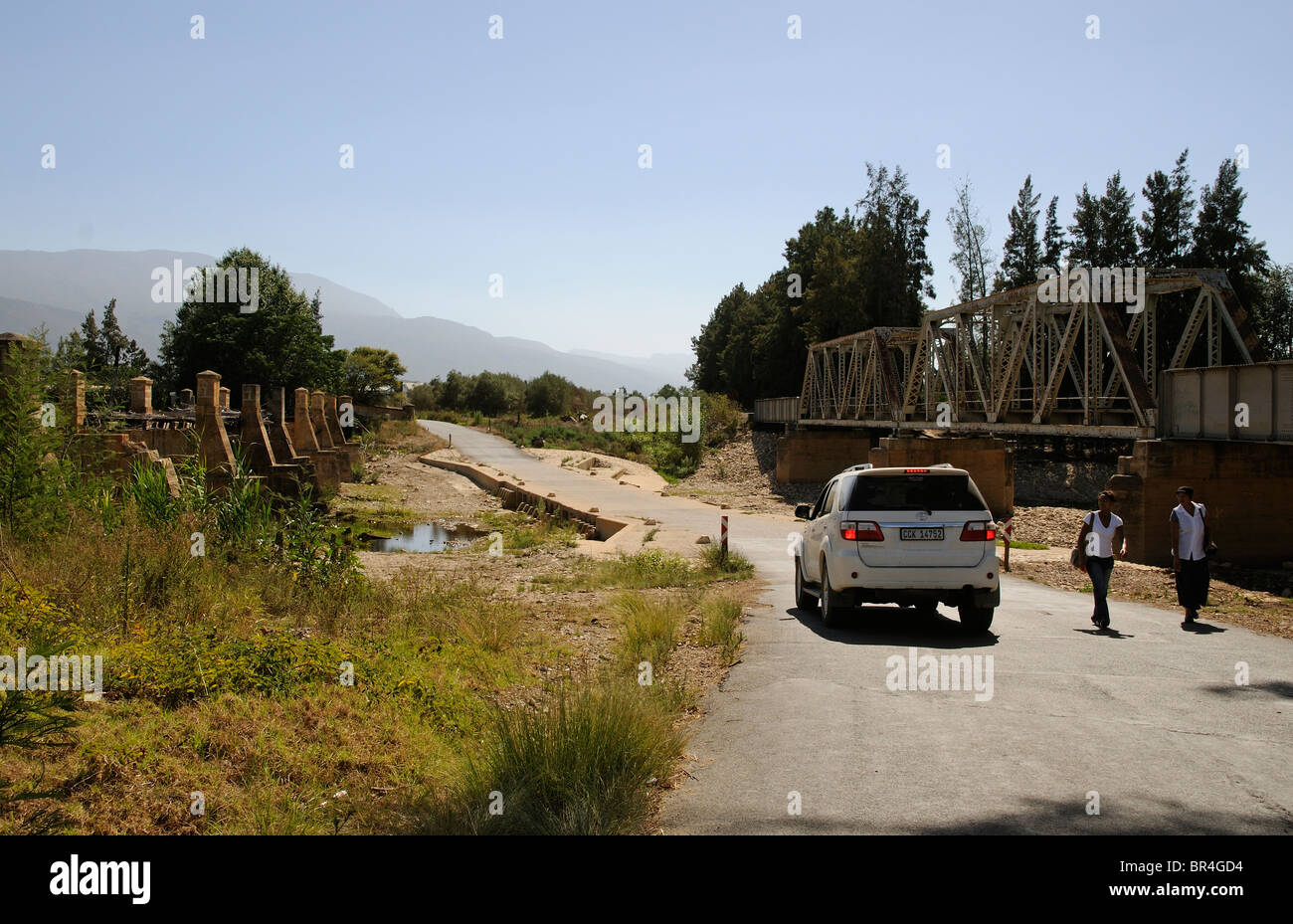 Steel railway bridge passing over the part dried riverbed of the ...