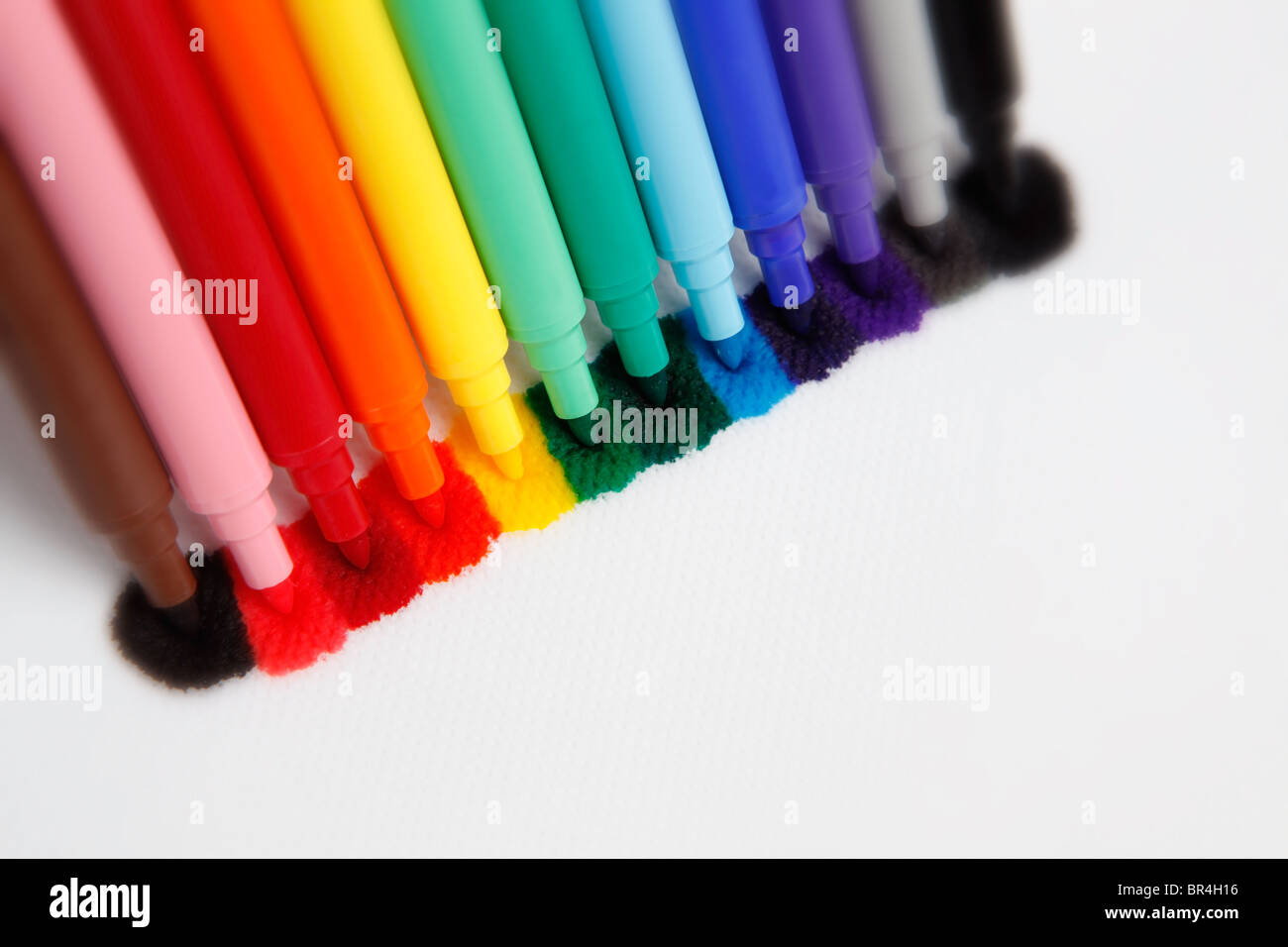 Colorful markers on white background. With beautiful vibrant colors ...