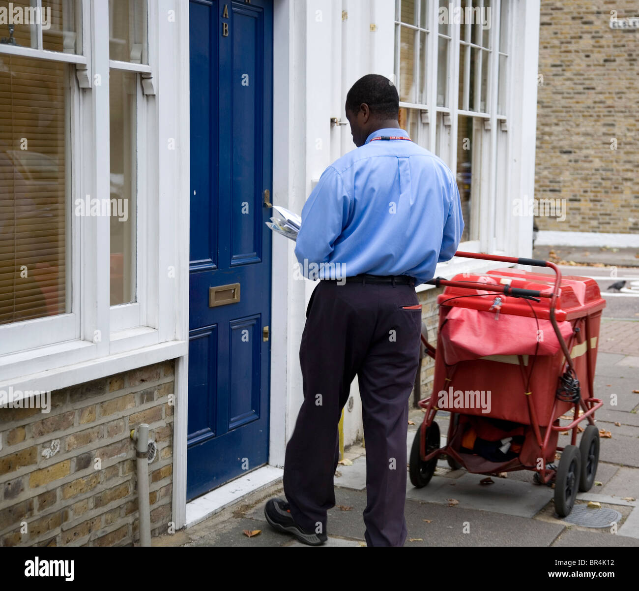 Postman delivering door hi-res stock photography and images - Alamy