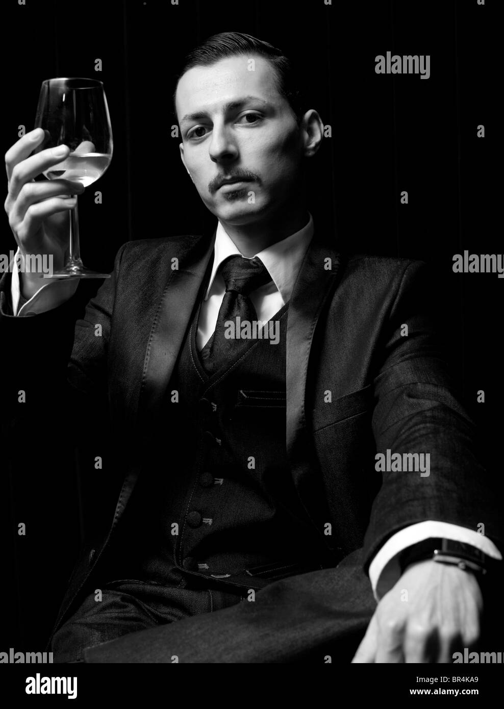 Black and white portrait of a gentleman raising a toast of wine ...