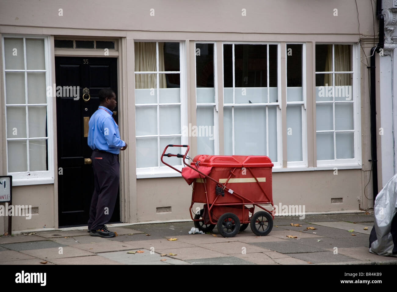 Postman delivering letters hi-res stock photography and images - Alamy