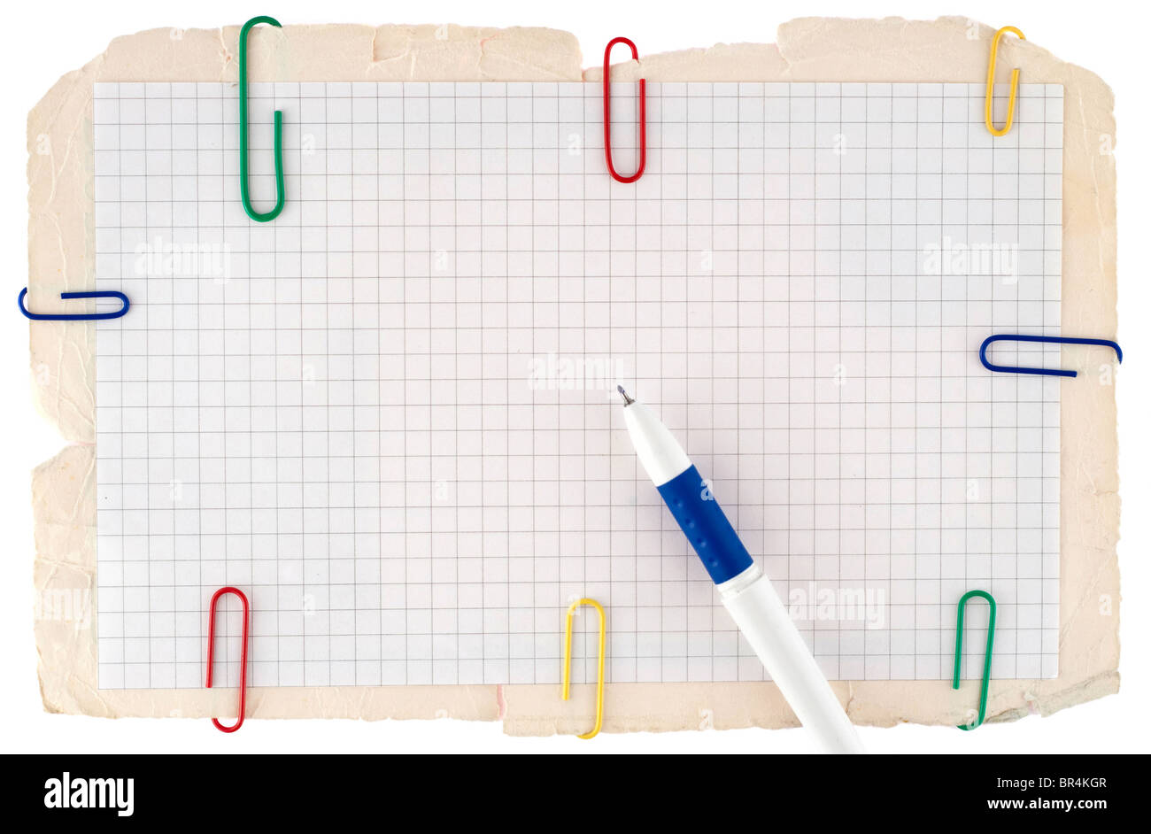 Checked notebook paper with a pen Stock Photo - Alamy