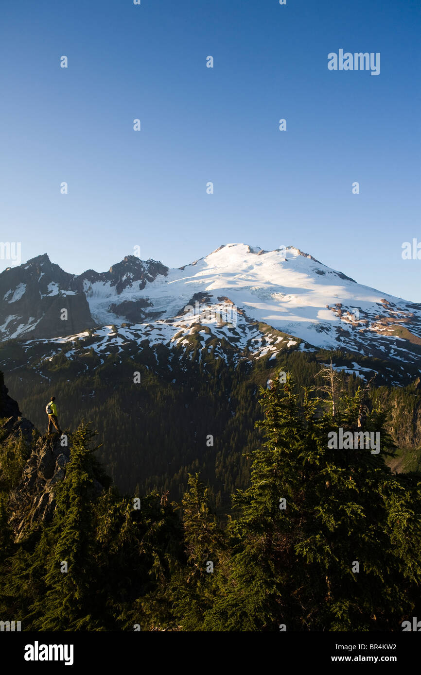 A hiker enjoys incredible views of Mt. Baker in western Washington ...