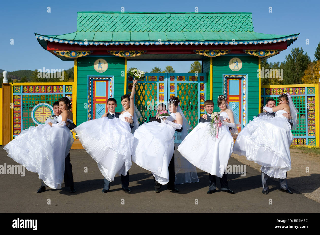 Five marrying couples Stock Photo - Alamy