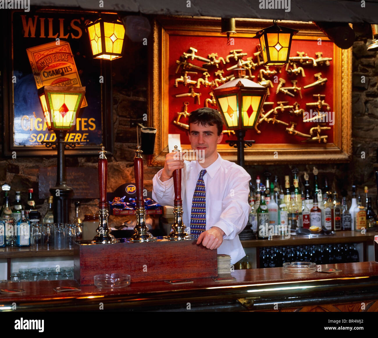 Ireland, Interior Of Pub, Barman Pulling A Pint Stock Photo - Alamy