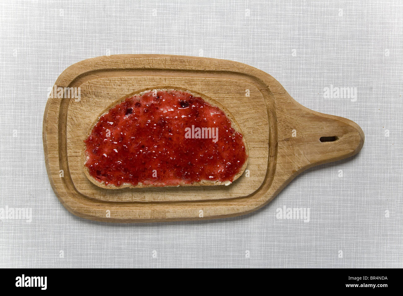 Fly on slice of bread with jam Stock Photo - Alamy