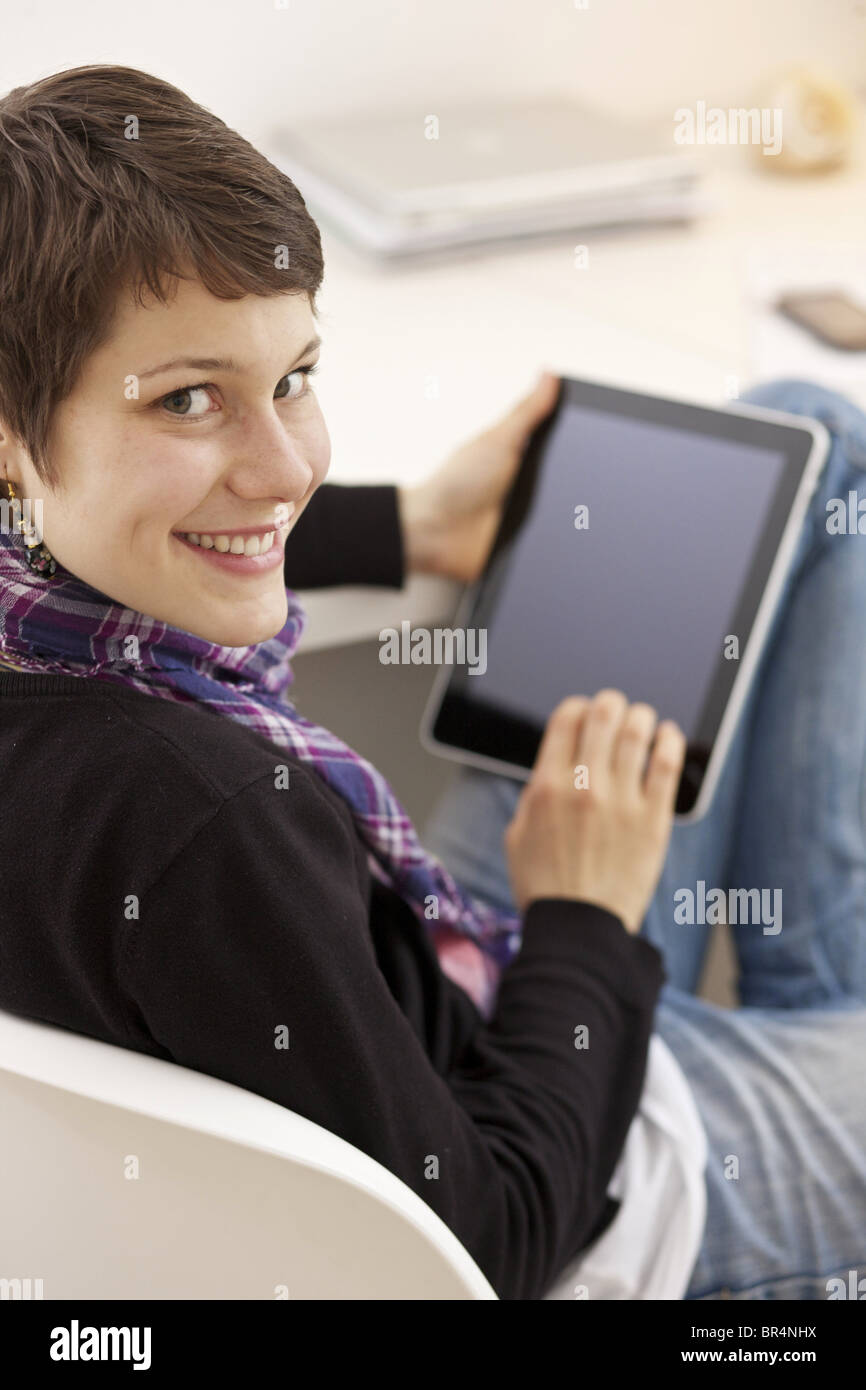 Woman using ipad over shoulder hi-res stock photography and images - Alamy