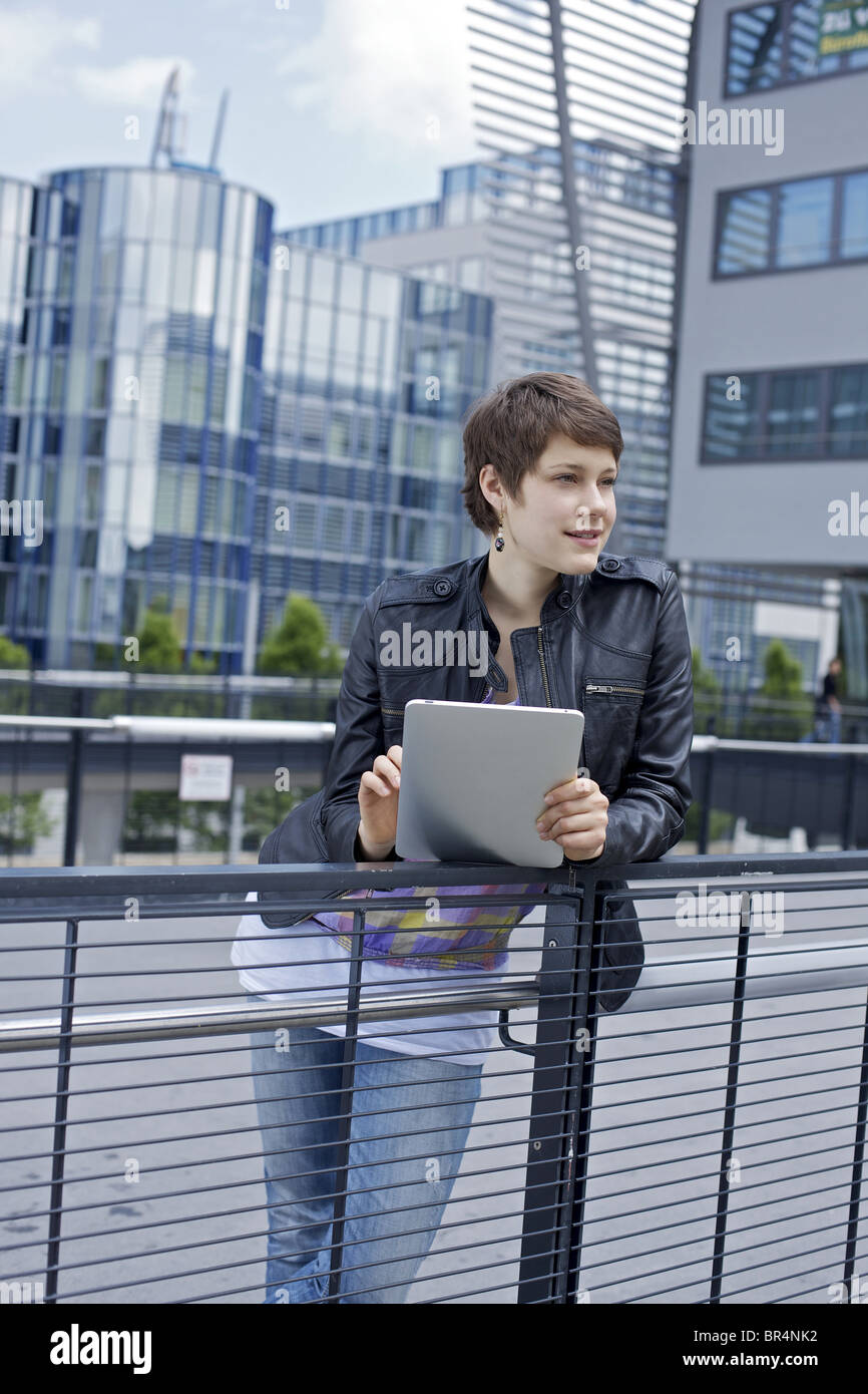 Woman using ipad standing hi-res stock photography and images - Alamy