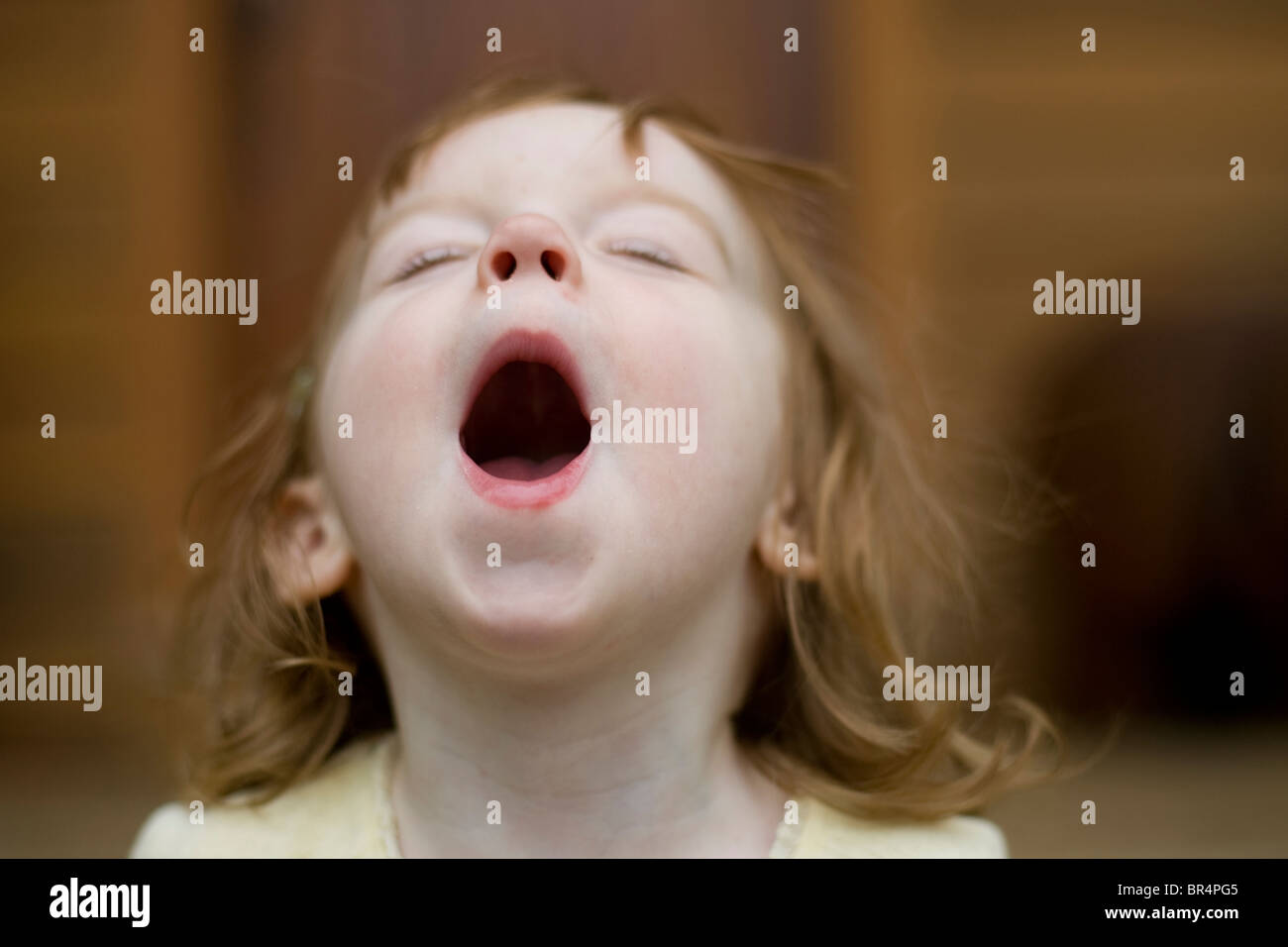 An toddler lets out a happy yell Stock Photo - Alamy