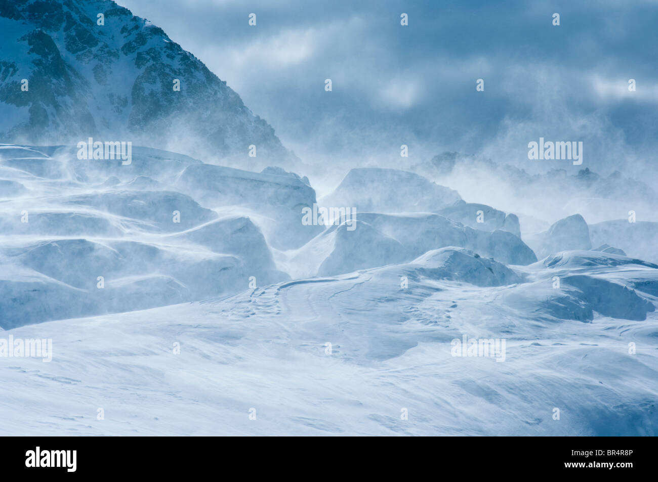 New Zealand, South Island, Arrowsmith Range. Blowing snow and icefall ...