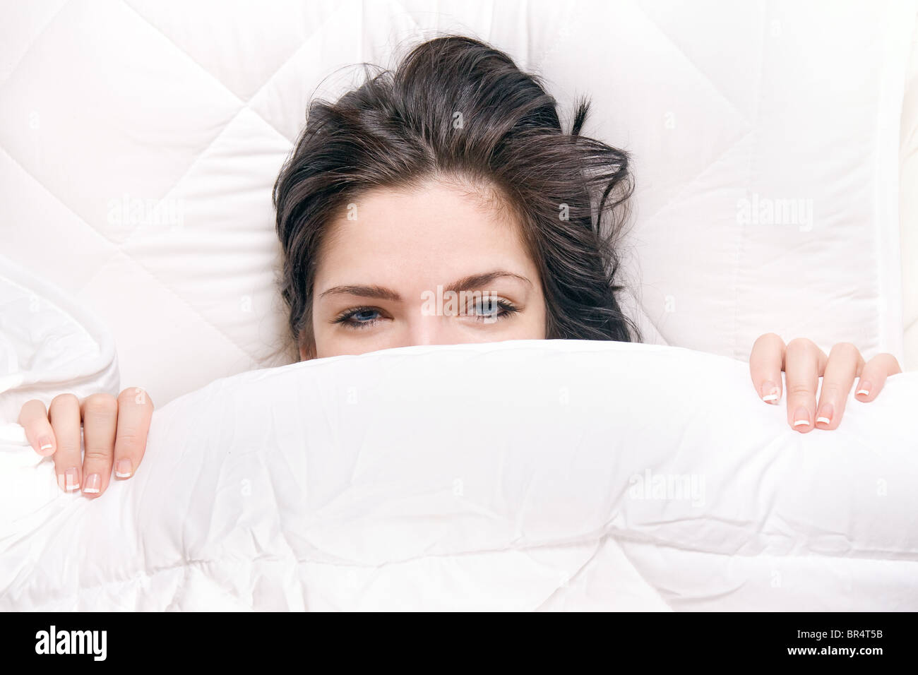 girl hides her face in bed Stock Photo - Alamy