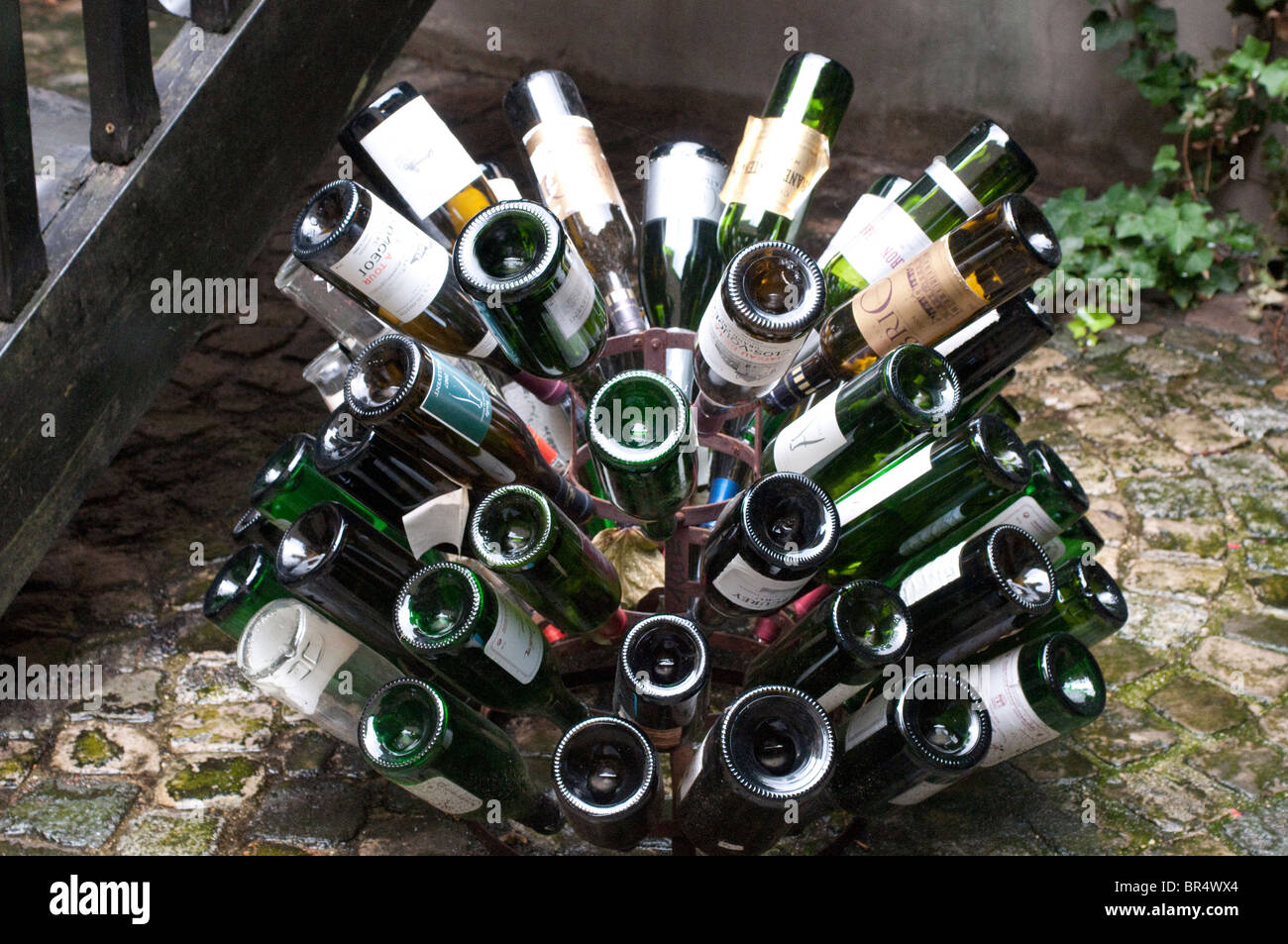 Empty wine bottles on a rack Stock Photo - Alamy