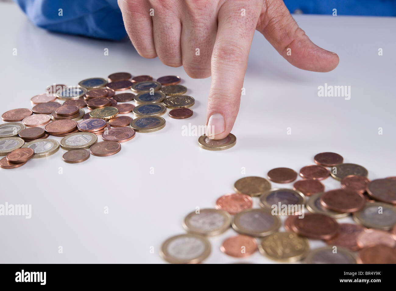 Hand sorting coins Stock Photo - Alamy