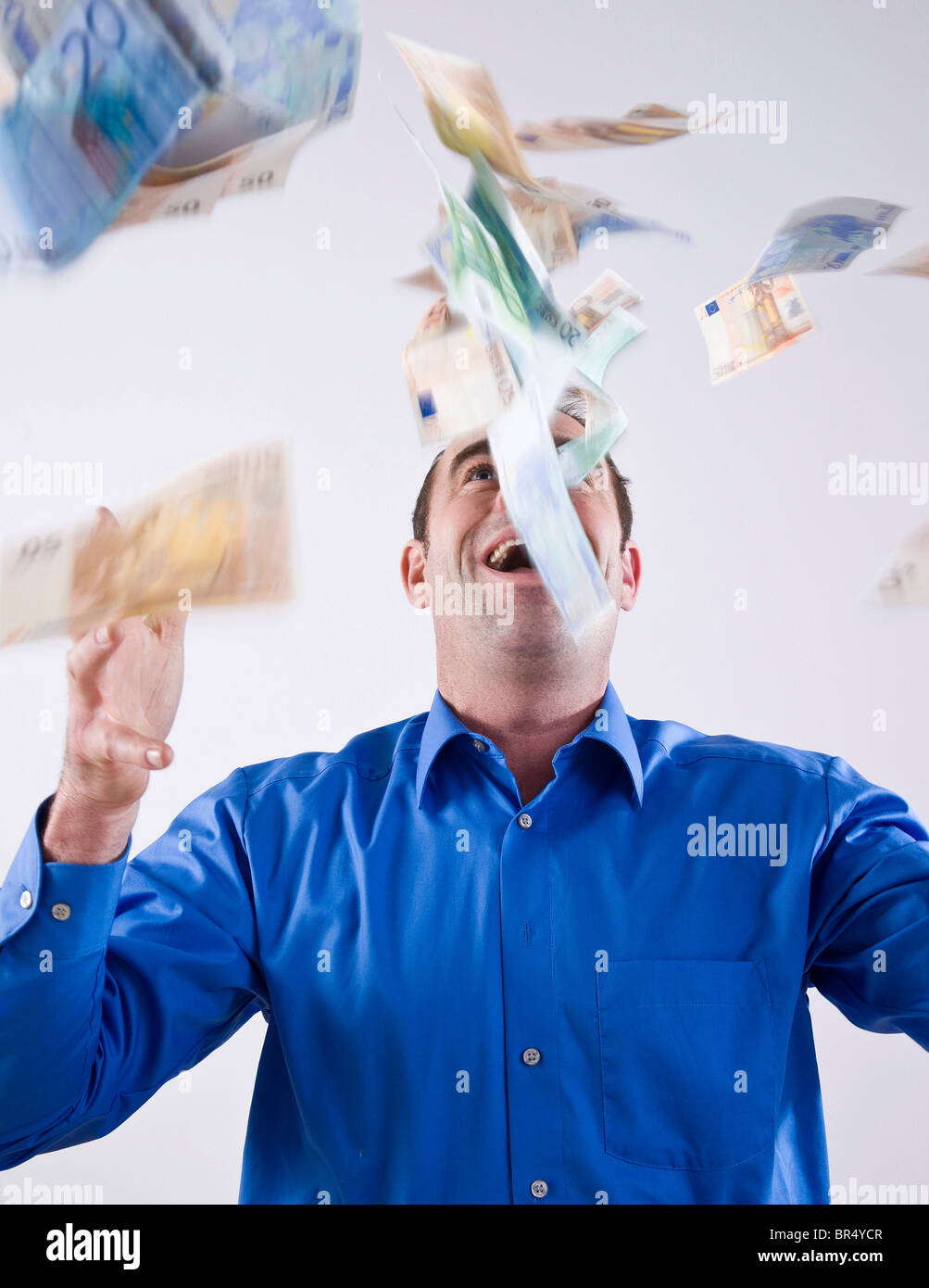 Man throwing up bank notes Stock Photo - Alamy